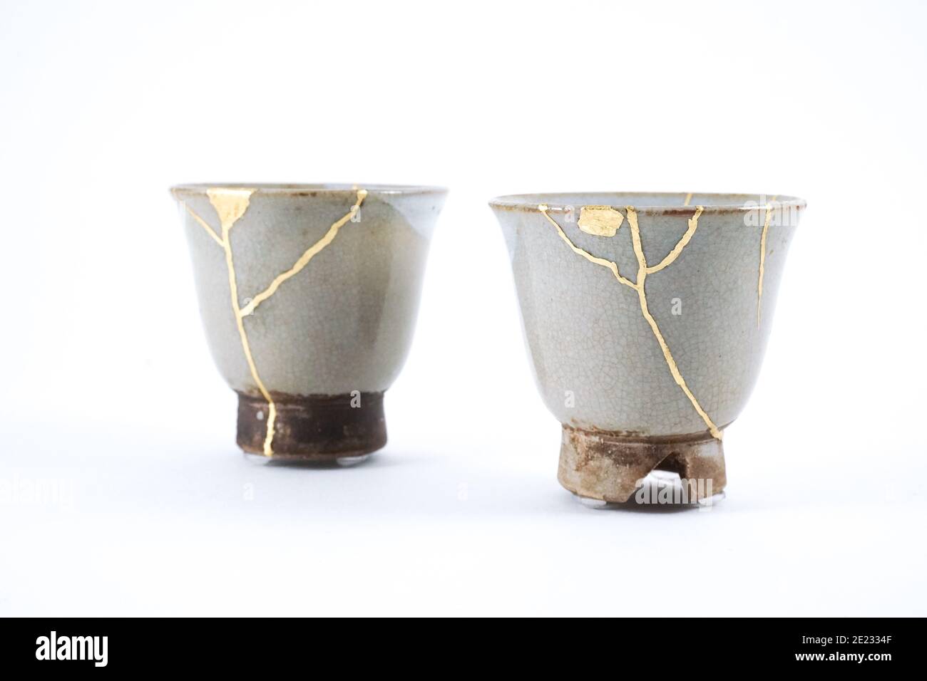 Beige Kintsugi Japanese sake cups isolated Stock Photo - Alamy