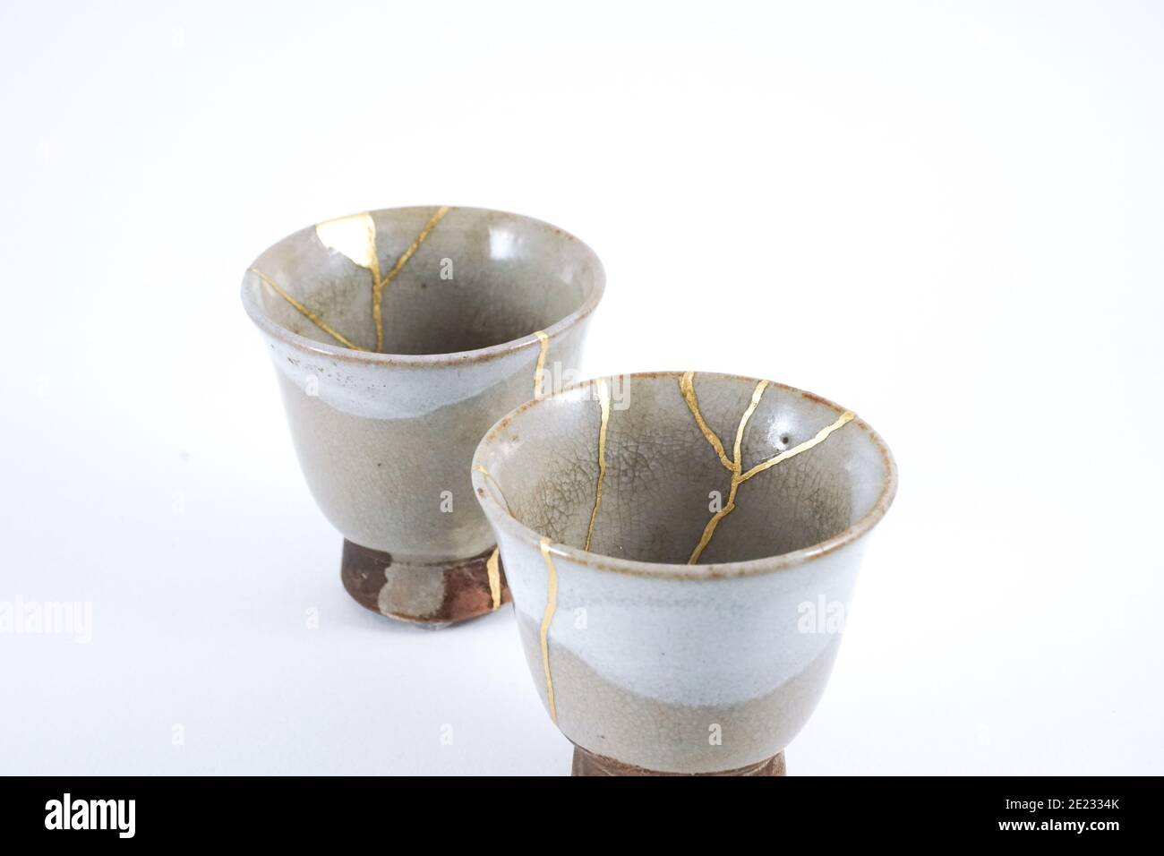 Beige Kintsugi Japanese sake cups isolated Stock Photo - Alamy