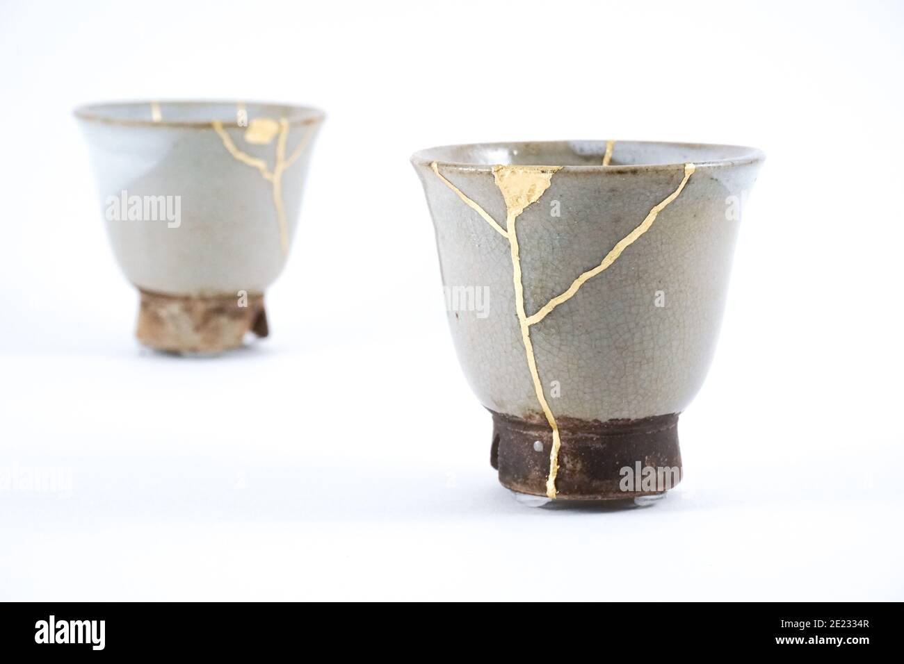 Beige Kintsugi Japanese sake cups isolated Stock Photo - Alamy