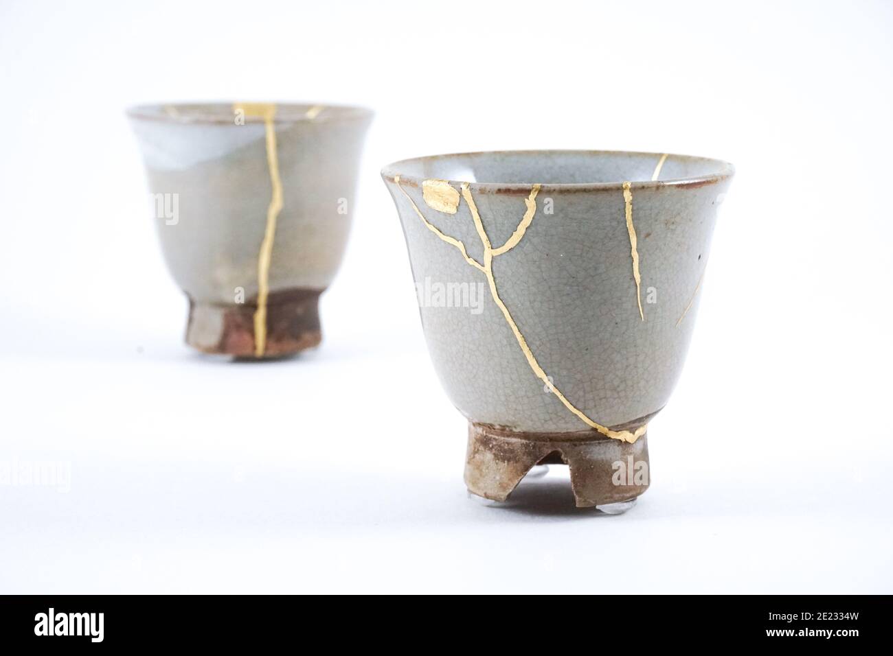 Beige Kintsugi Japanese sake cups isolated Stock Photo - Alamy