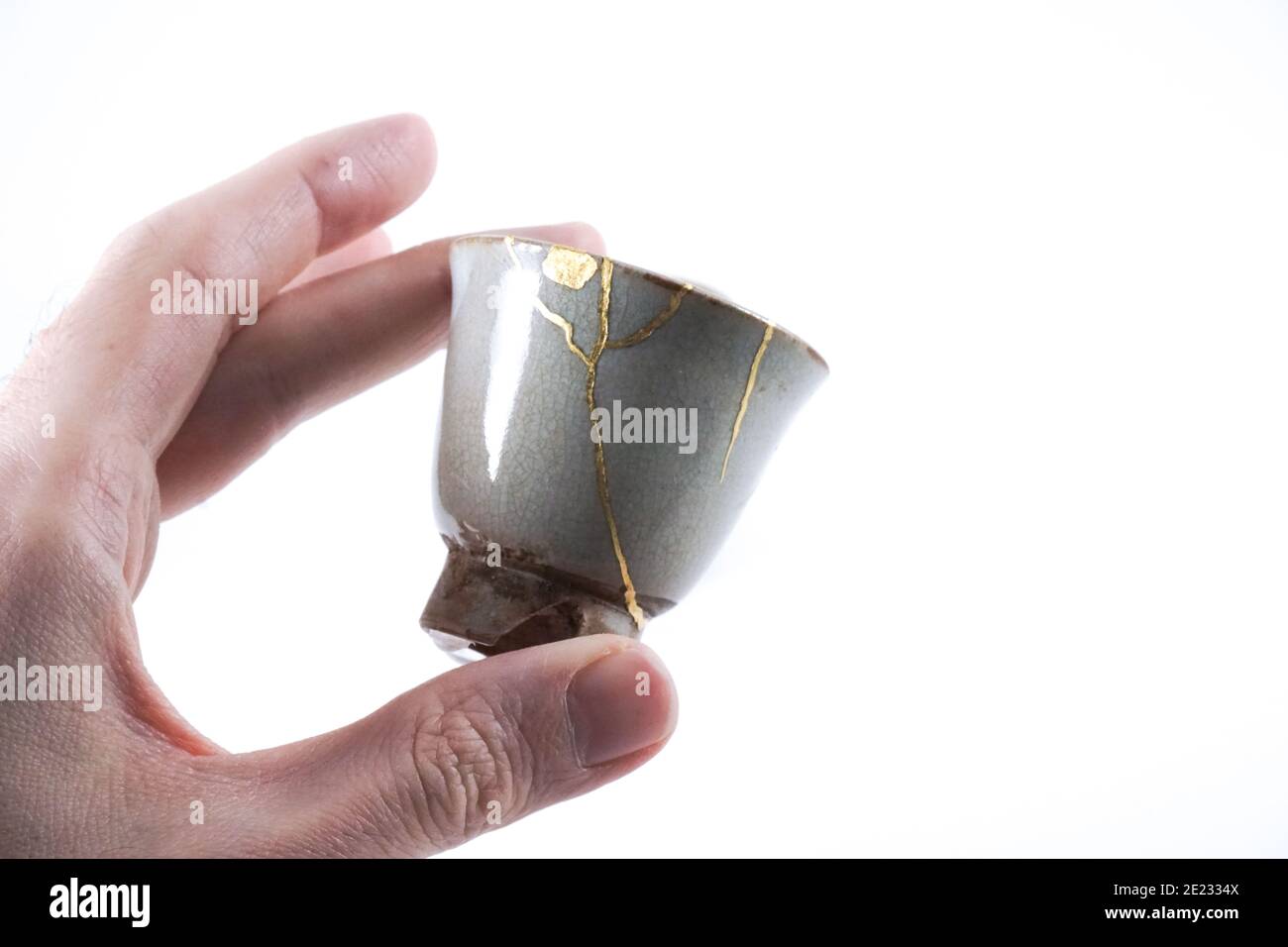 Beige Kintsugi Japanese sake cups isolated Stock Photo - Alamy