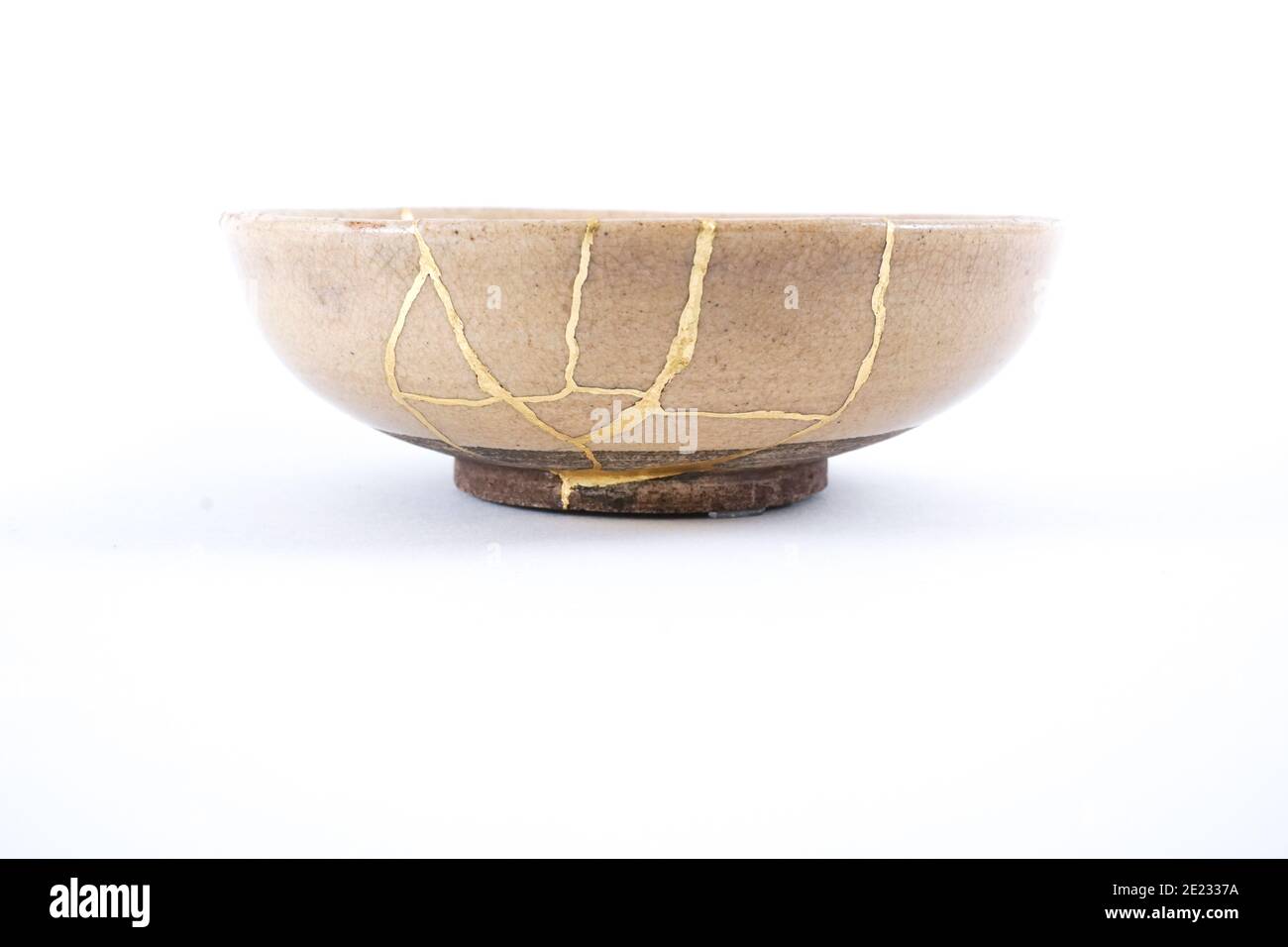 Japanese beige Kintsugi bowl Stock Photo - Alamy