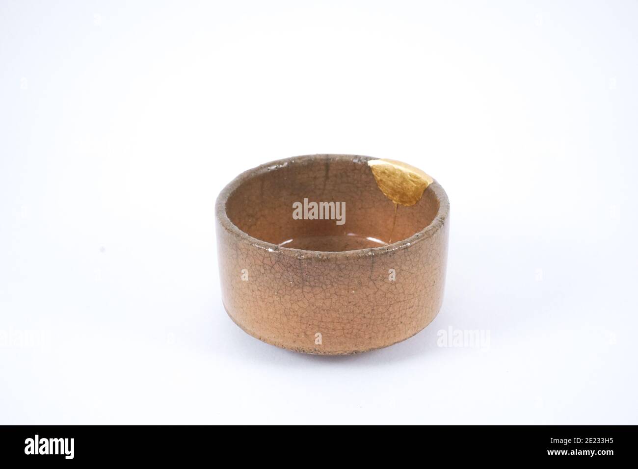 Beige Kintsugi Japanese sake cups isolated Stock Photo - Alamy