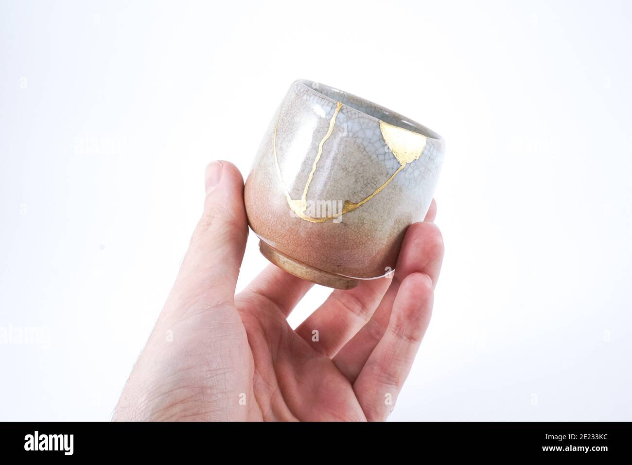 Beige Kintsugi Japanese sake cups isolated Stock Photo - Alamy