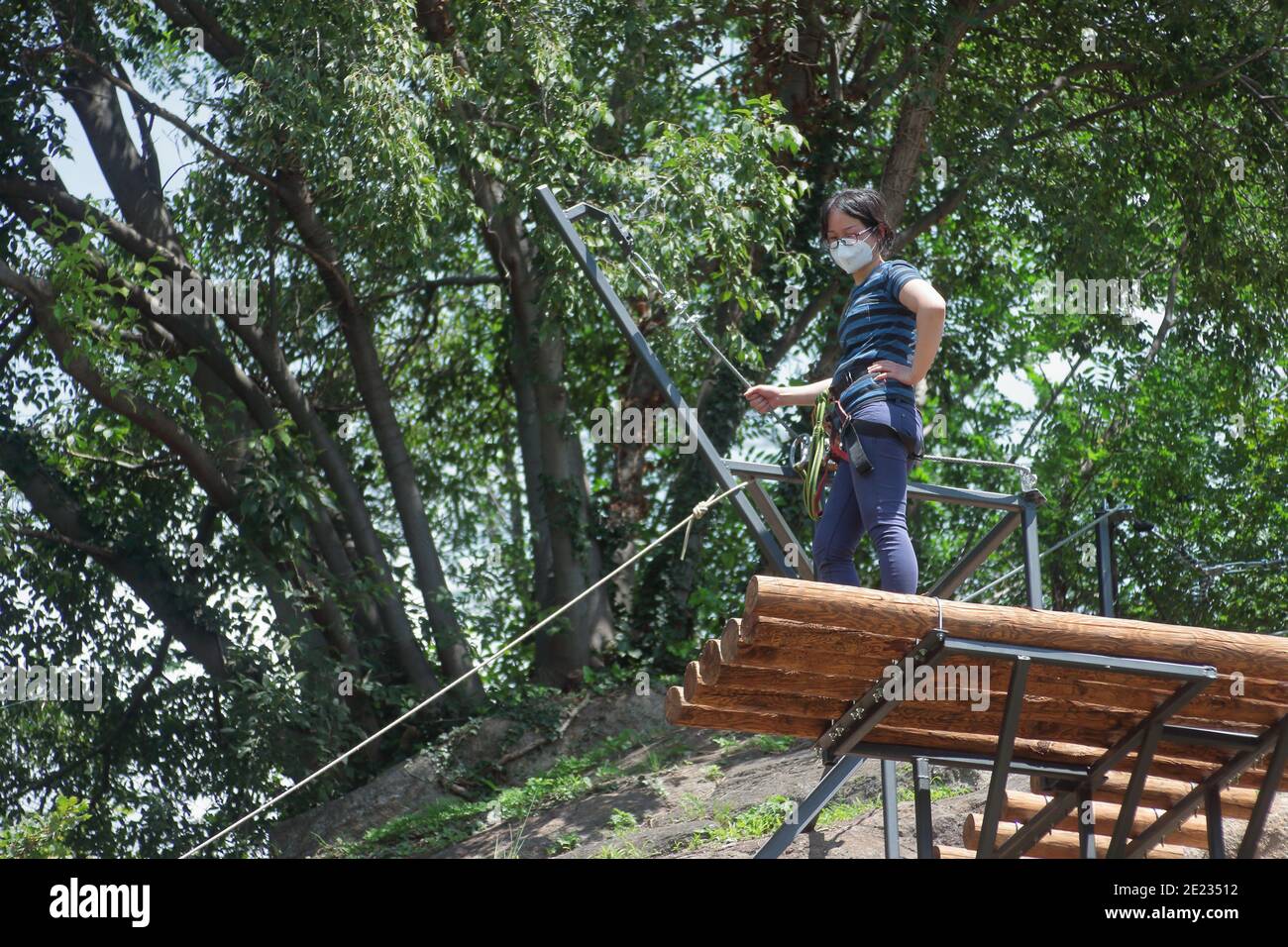 Montestrutto, Italian alps - June 2020: a girl throws herself into a ...