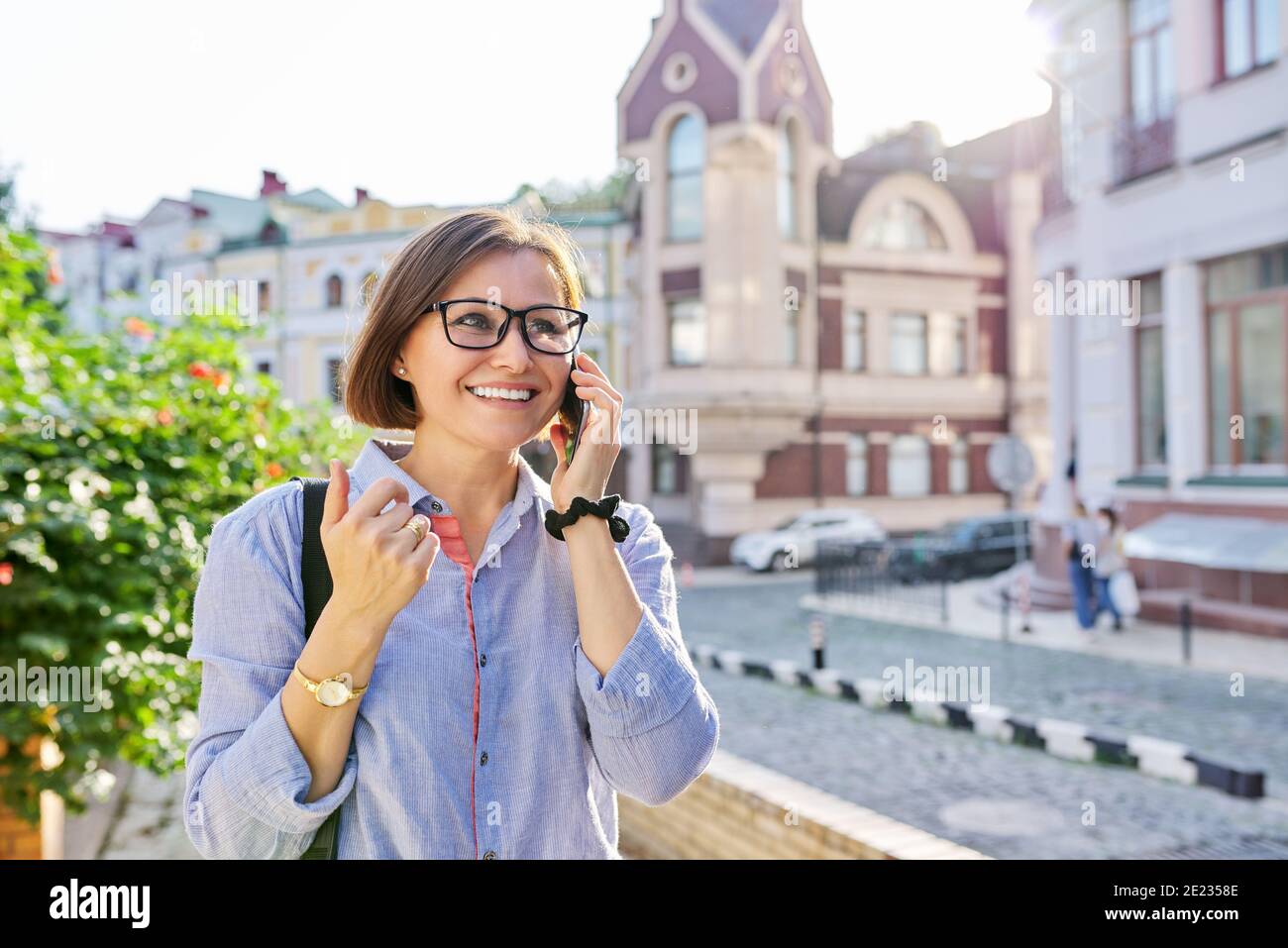 Attractive mature female walking talking hi-res stock photography and ...
