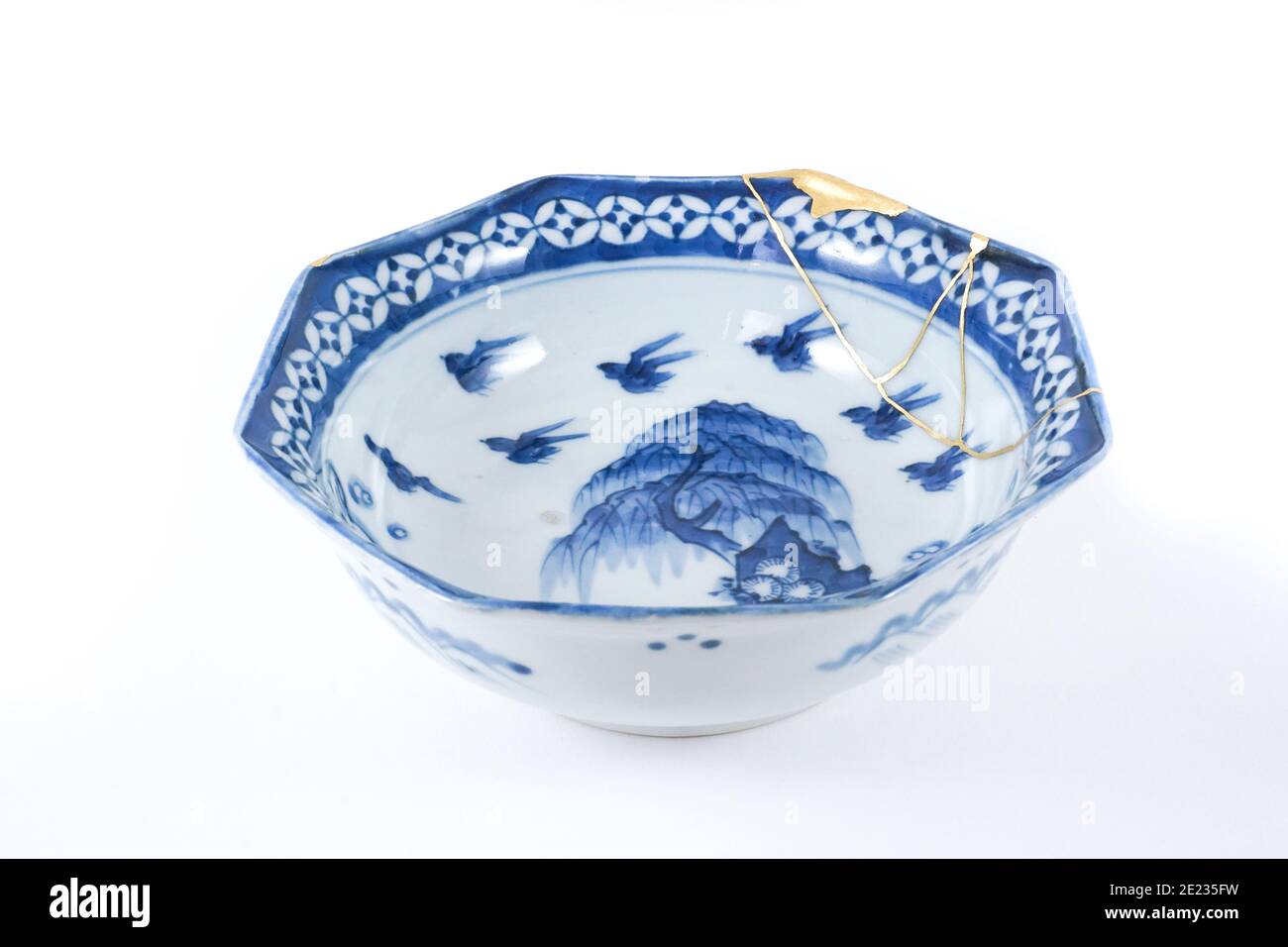 Antique Japanese Kintsugi bowl blue and white Stock Photo - Alamy