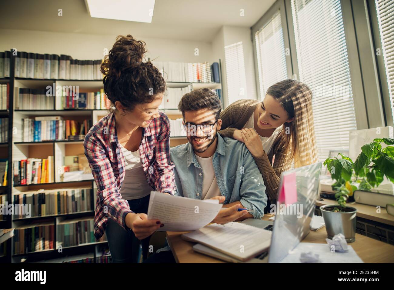 Helping a friend at school hi-res stock photography and images - Alamy