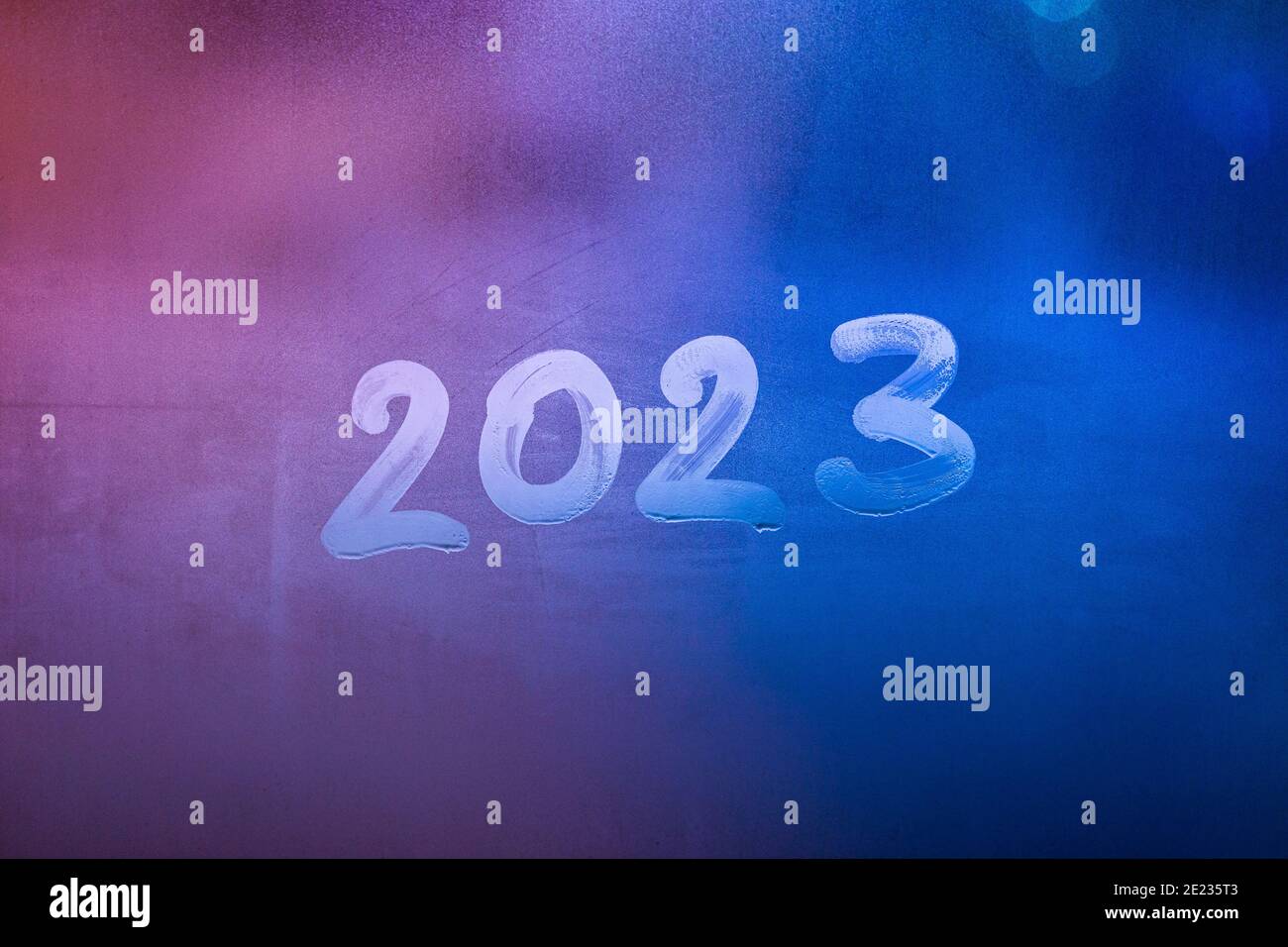number 2023 handwritten on wet night window glass surface Stock Photo ...