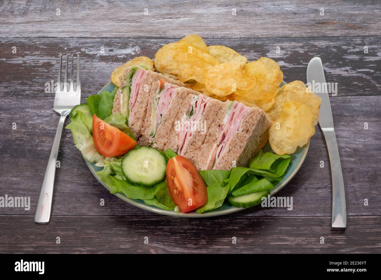 Ham sandwich with crisps and salad on a plate Stock Photo - Alamy
