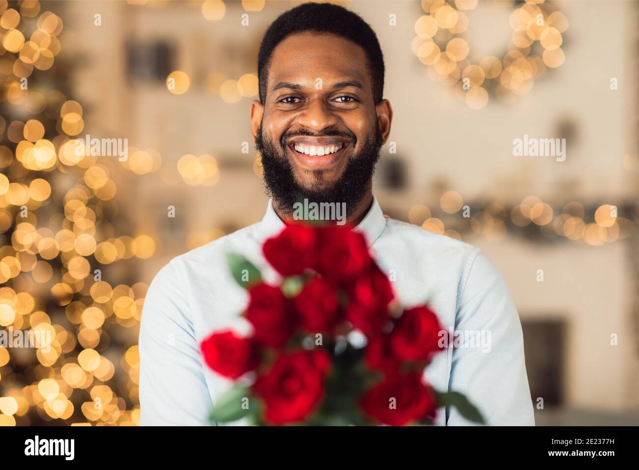 African man showing red gift hi-res stock photography and images - Alamy
