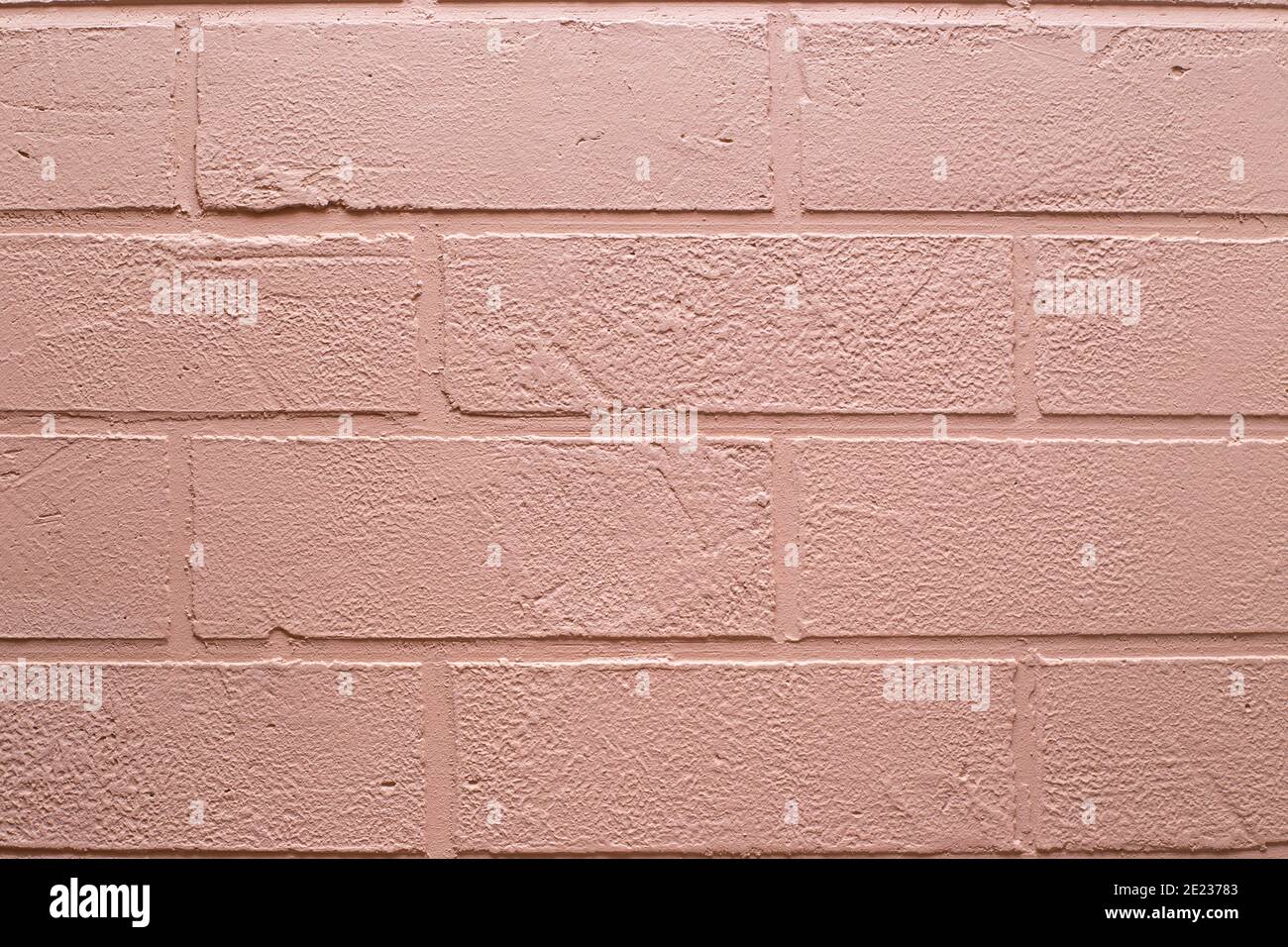 Brick wall. Decorative plaster in the form of a brick, painted in beige ...