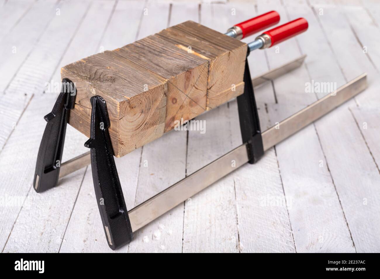 Joiner clamp for gluing wood. Carpentry accessories in the workshop ...