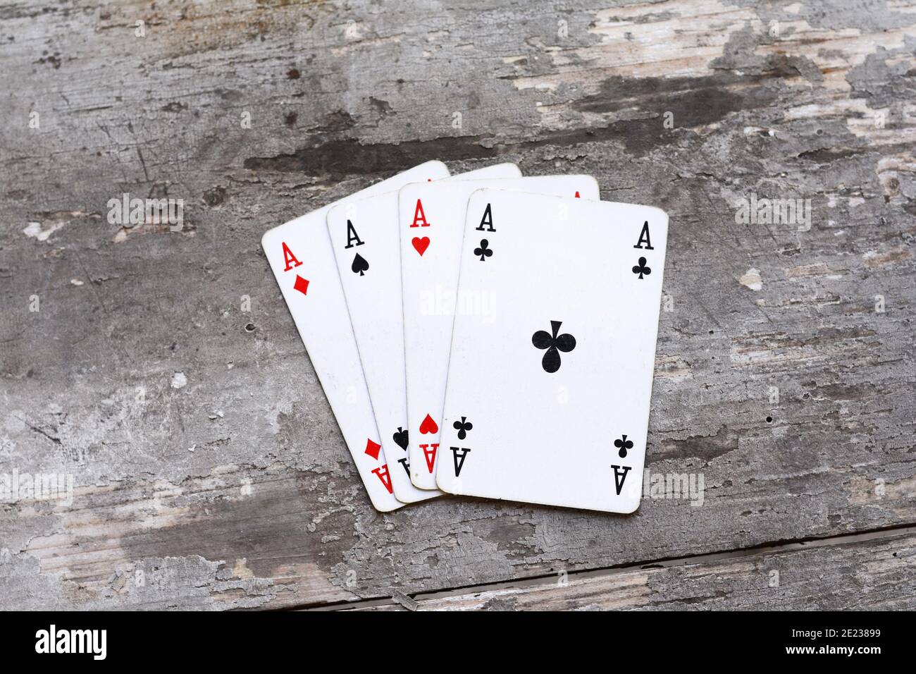 Pile of playing cards at a rustic wooden board Stock Photo - Alamy