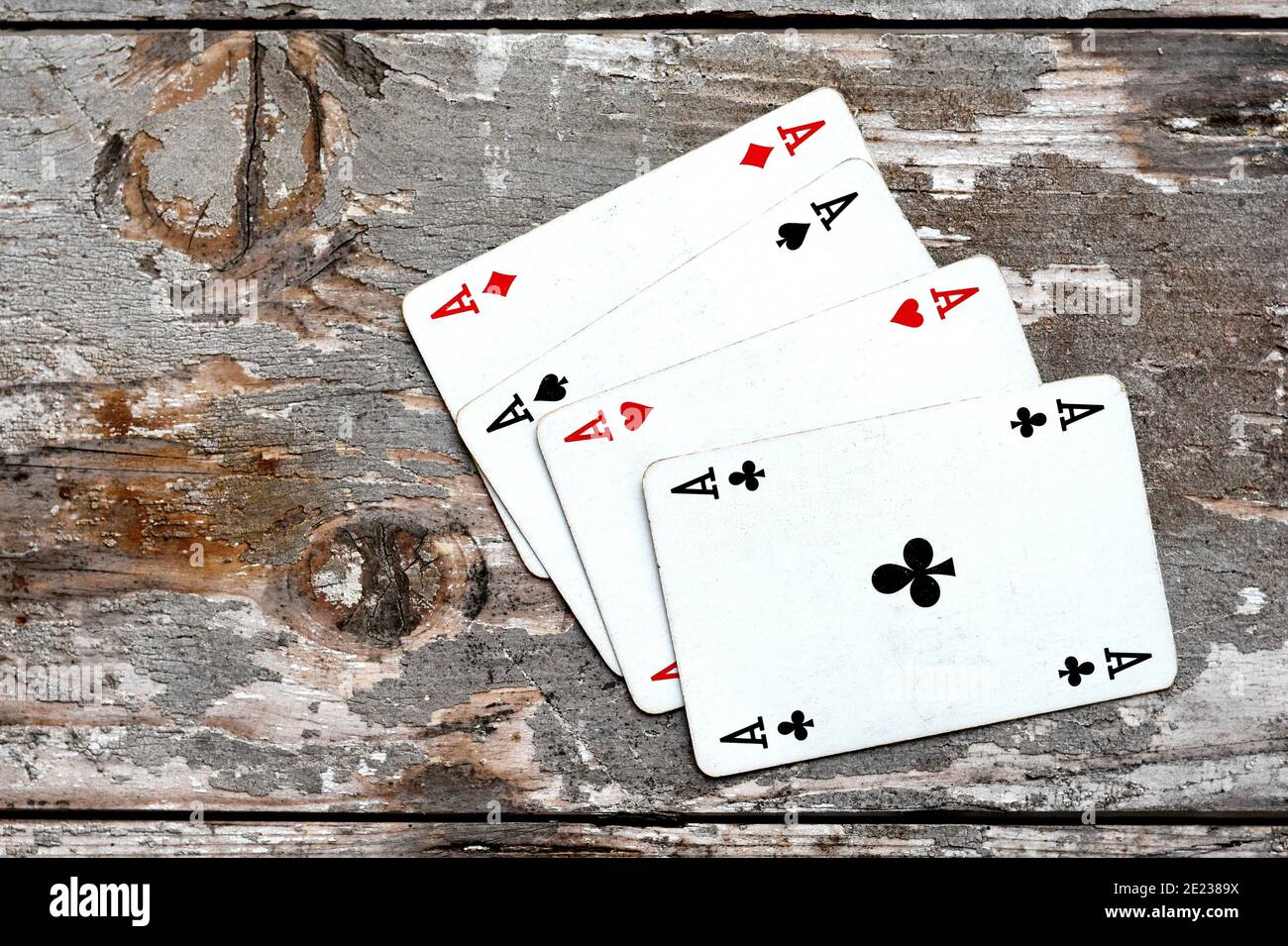 Pile of playing cards at a rustic wooden board Stock Photo - Alamy