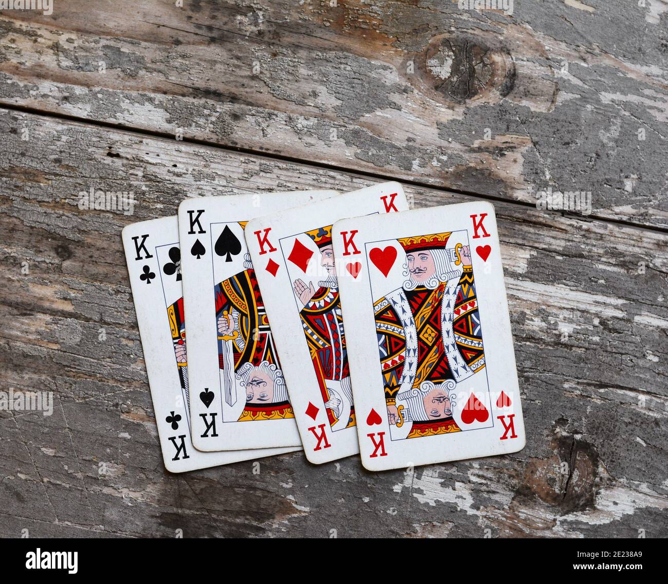 Pile of playing cards at a rustic wooden board Stock Photo - Alamy