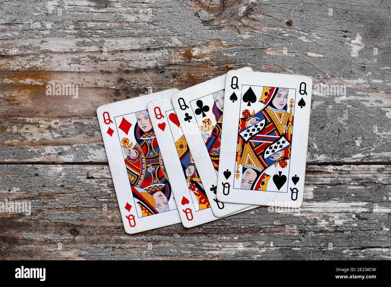 Pile of playing cards at a rustic wooden board Stock Photo - Alamy