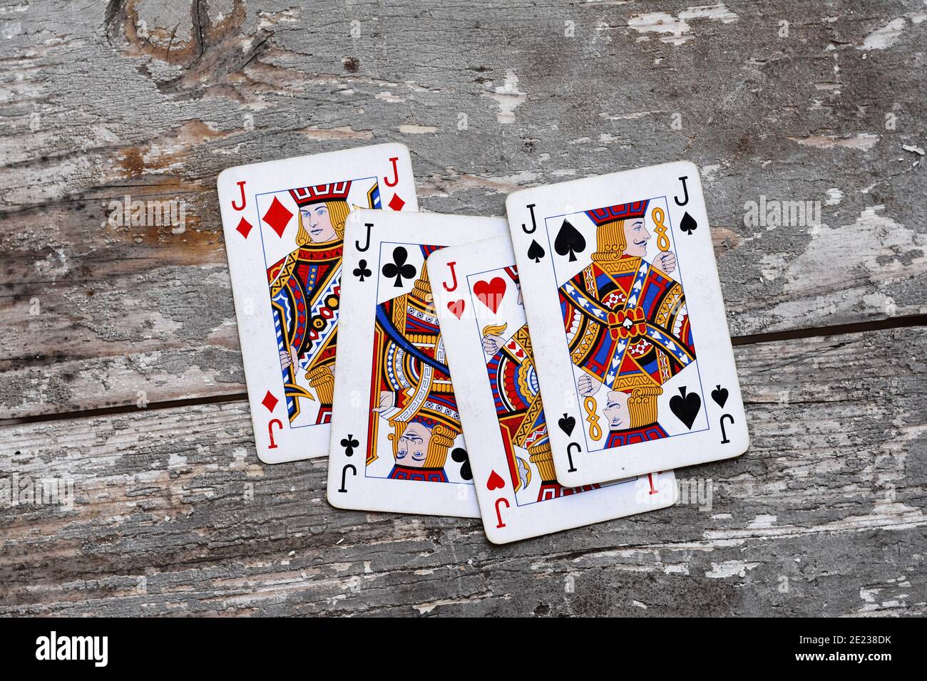 Pile of playing cards at a rustic wooden board Stock Photo - Alamy