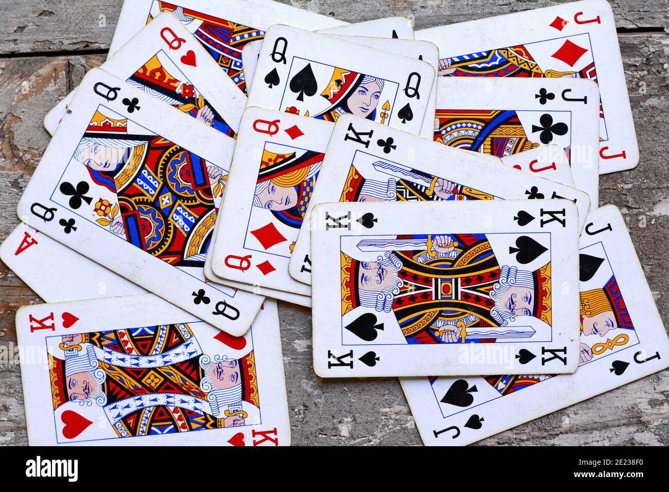 Pile of playing cards at a rustic wooden board Stock Photo - Alamy