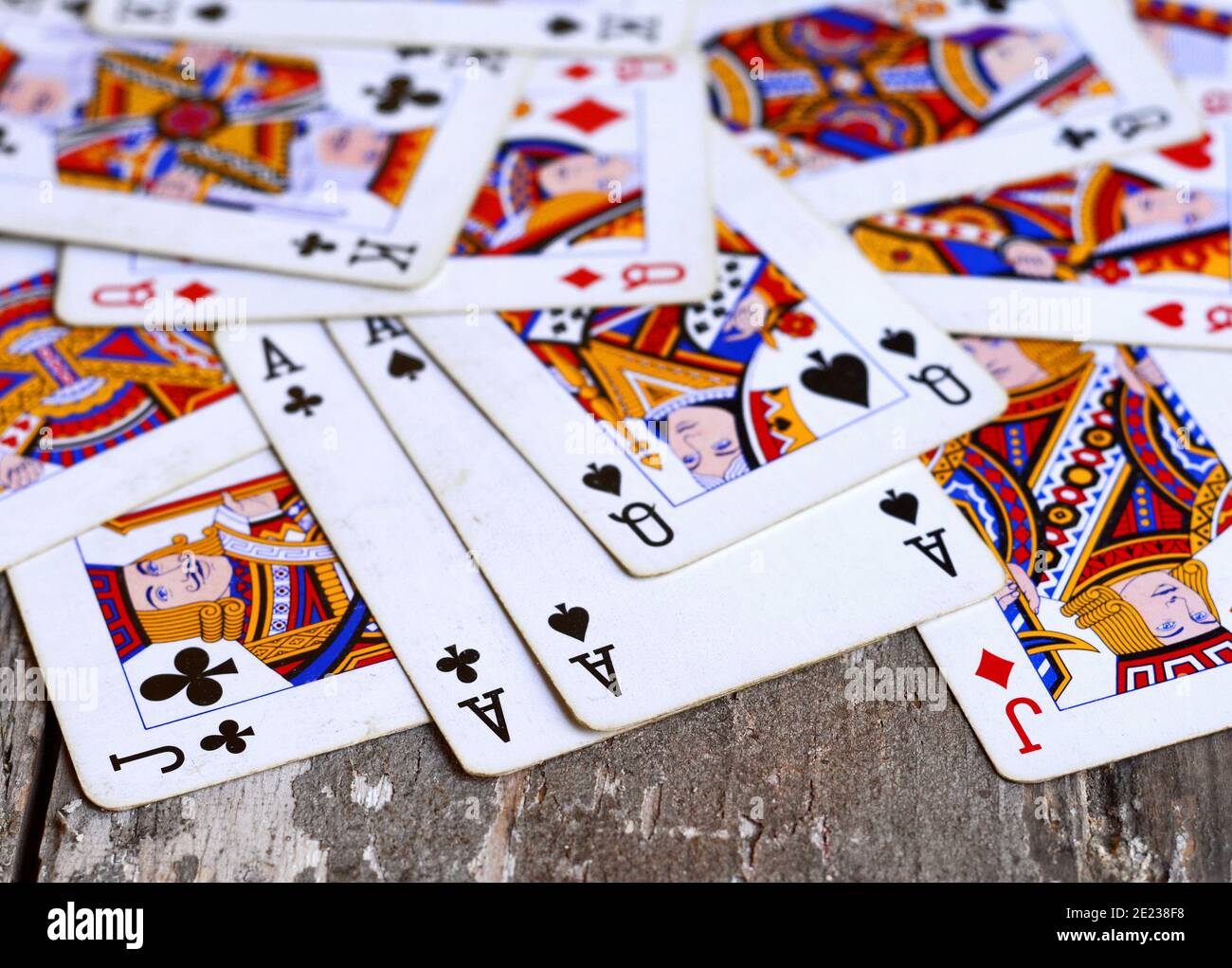 Pile of playing cards at a rustic wooden board Stock Photo - Alamy