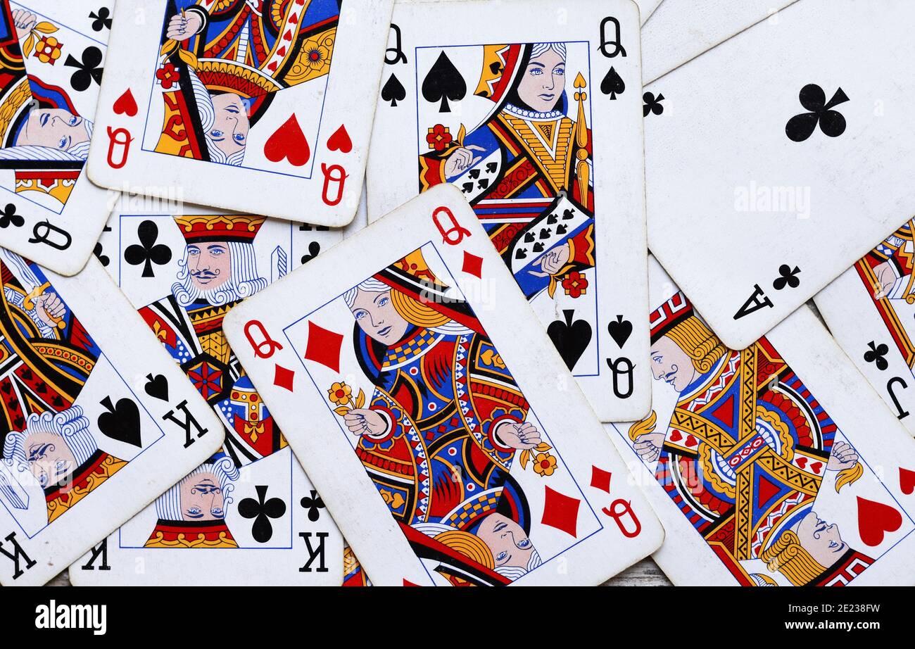 Pile of playing cards at a rustic wooden board Stock Photo - Alamy