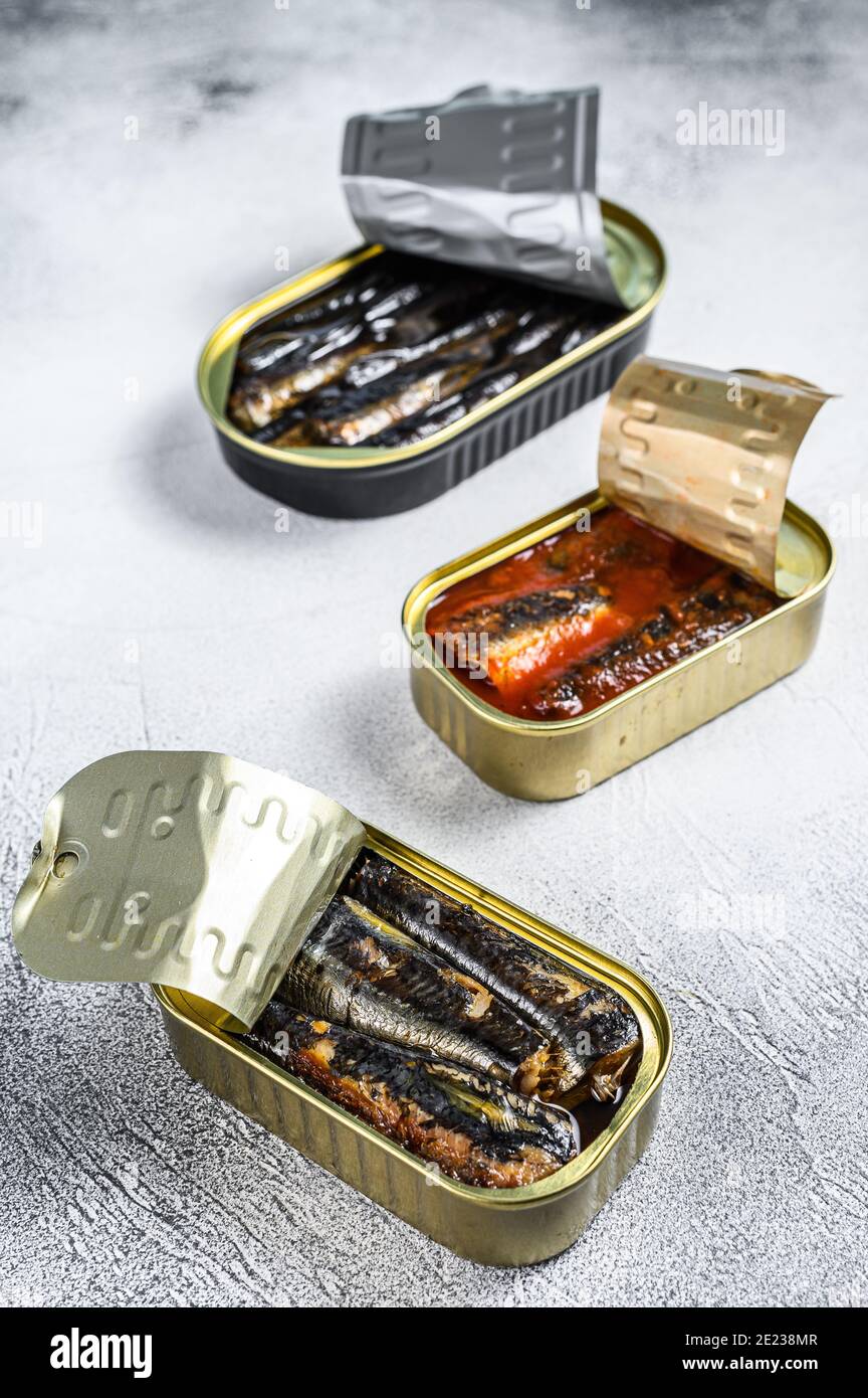 Assorted canned fish in a tin sardine, smoked sardine, mackerel. Grey ...