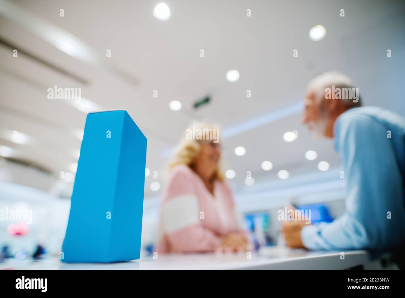 An old couple at tech store Stock Photo - Alamy