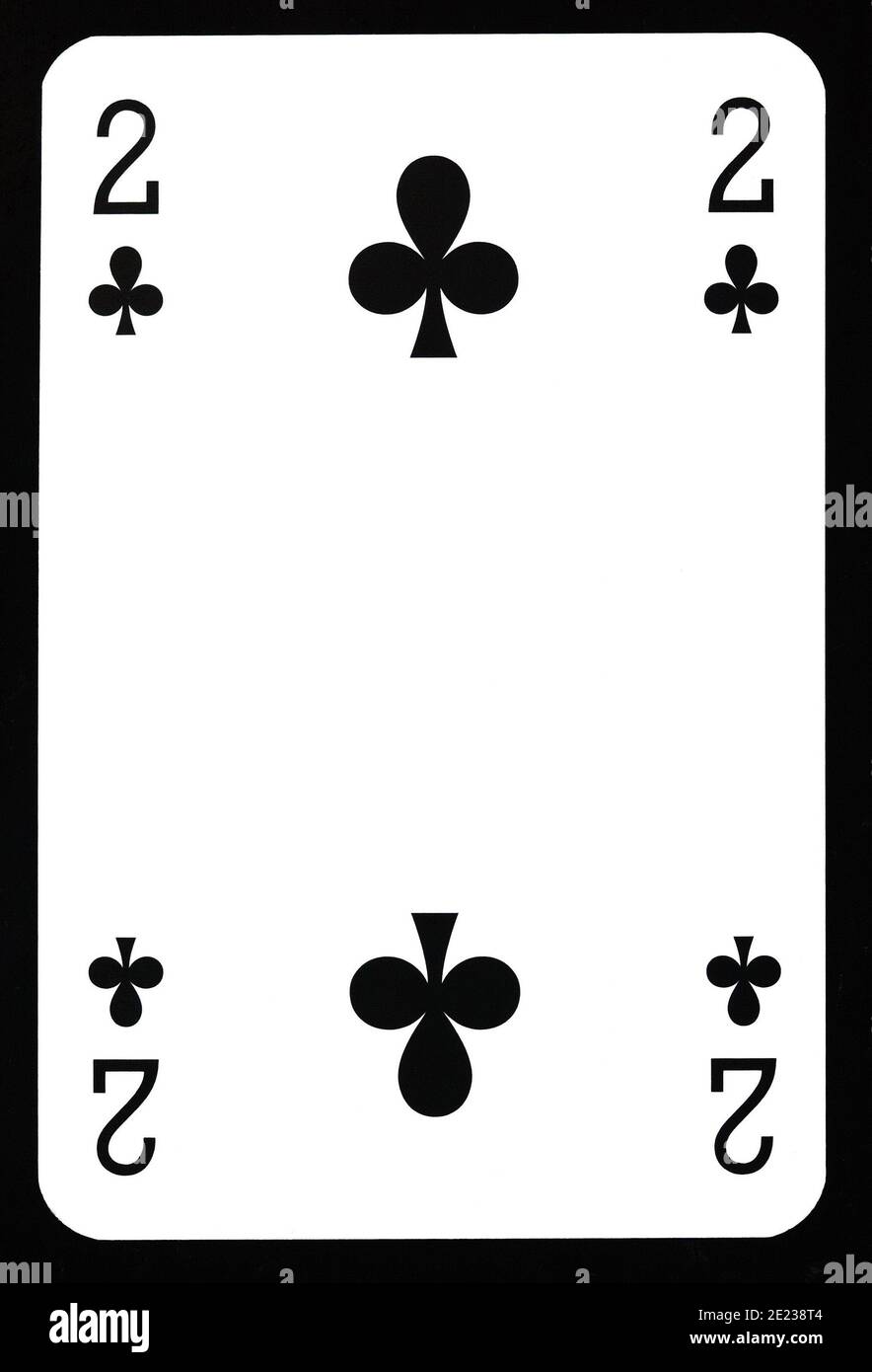 Two of clubs playing card isolated on black Stock Photo - Alamy