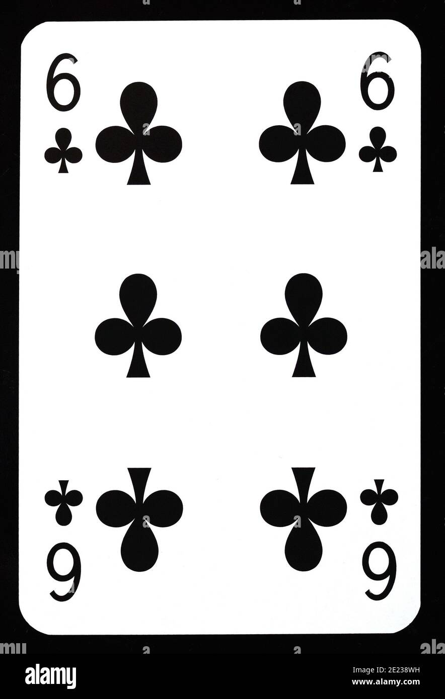 Six of clubs playing card isolated on black Stock Photo - Alamy