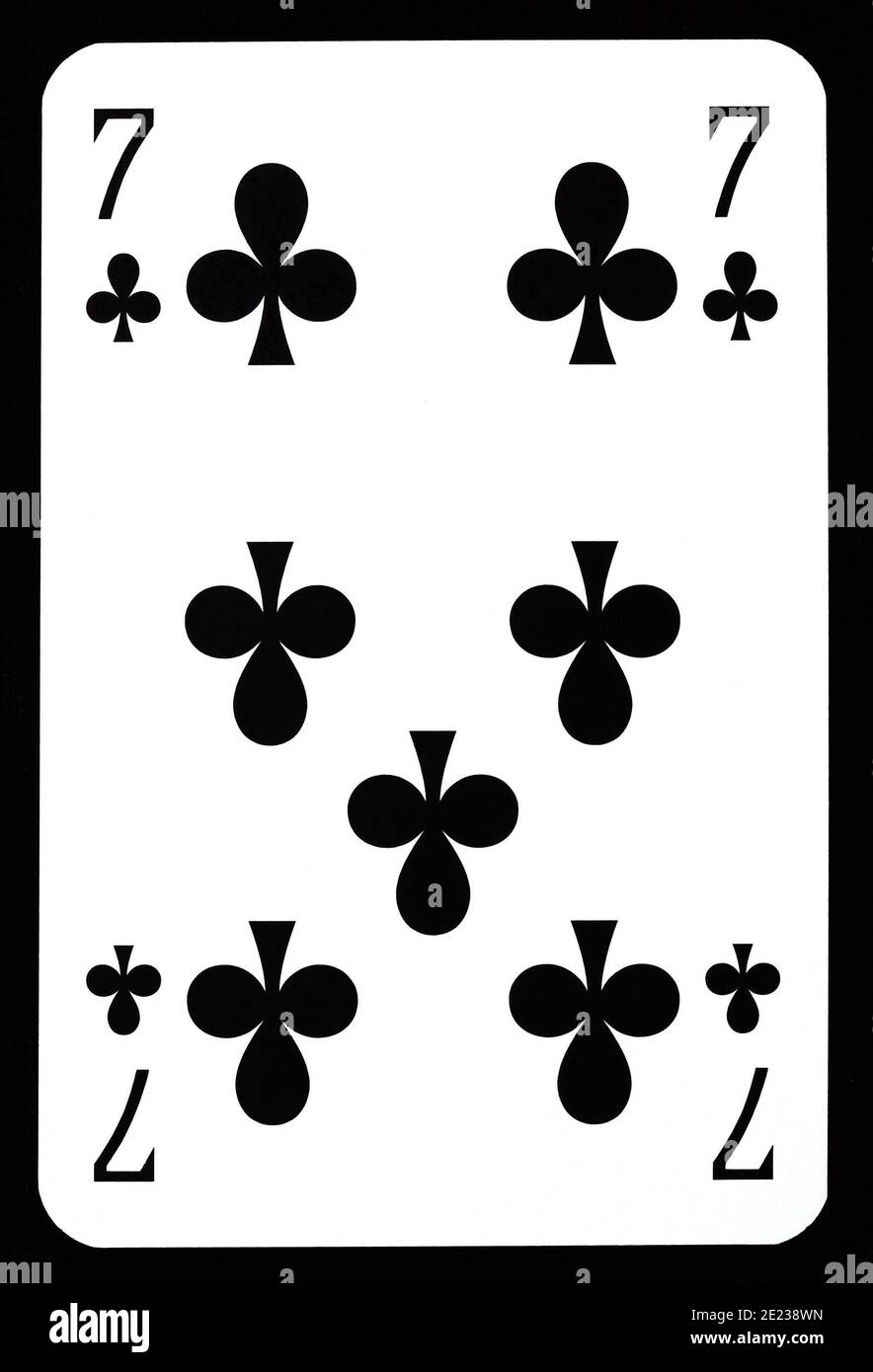 Seven of clubs playing card isolated on black Stock Photo - Alamy