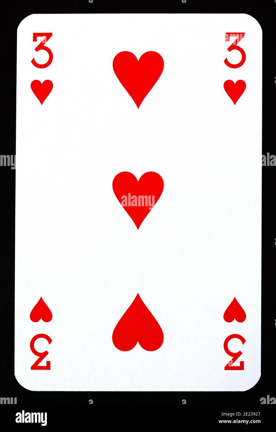 Three of hearts playing card isolated on black Stock Photo - Alamy