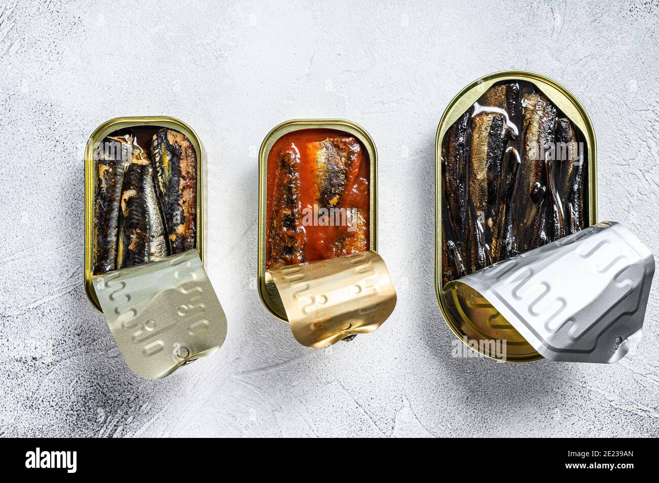 Assorted canned fish in a tin sardine, smoked sardine, mackerel. Grey ...
