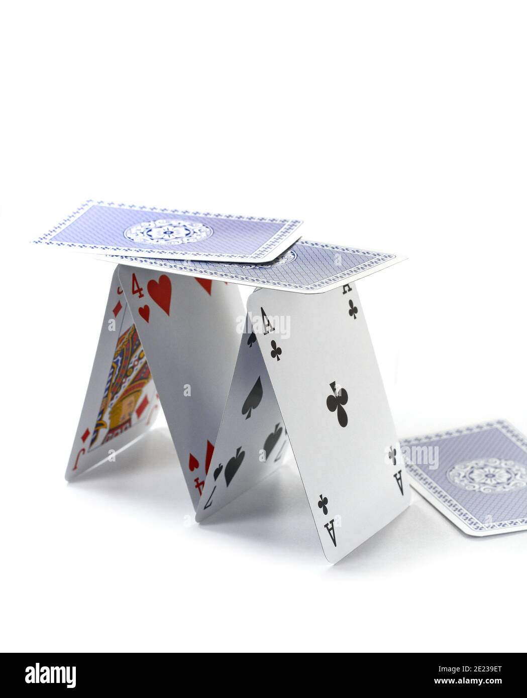 House of playing card isolated on white background Stock Photo - Alamy