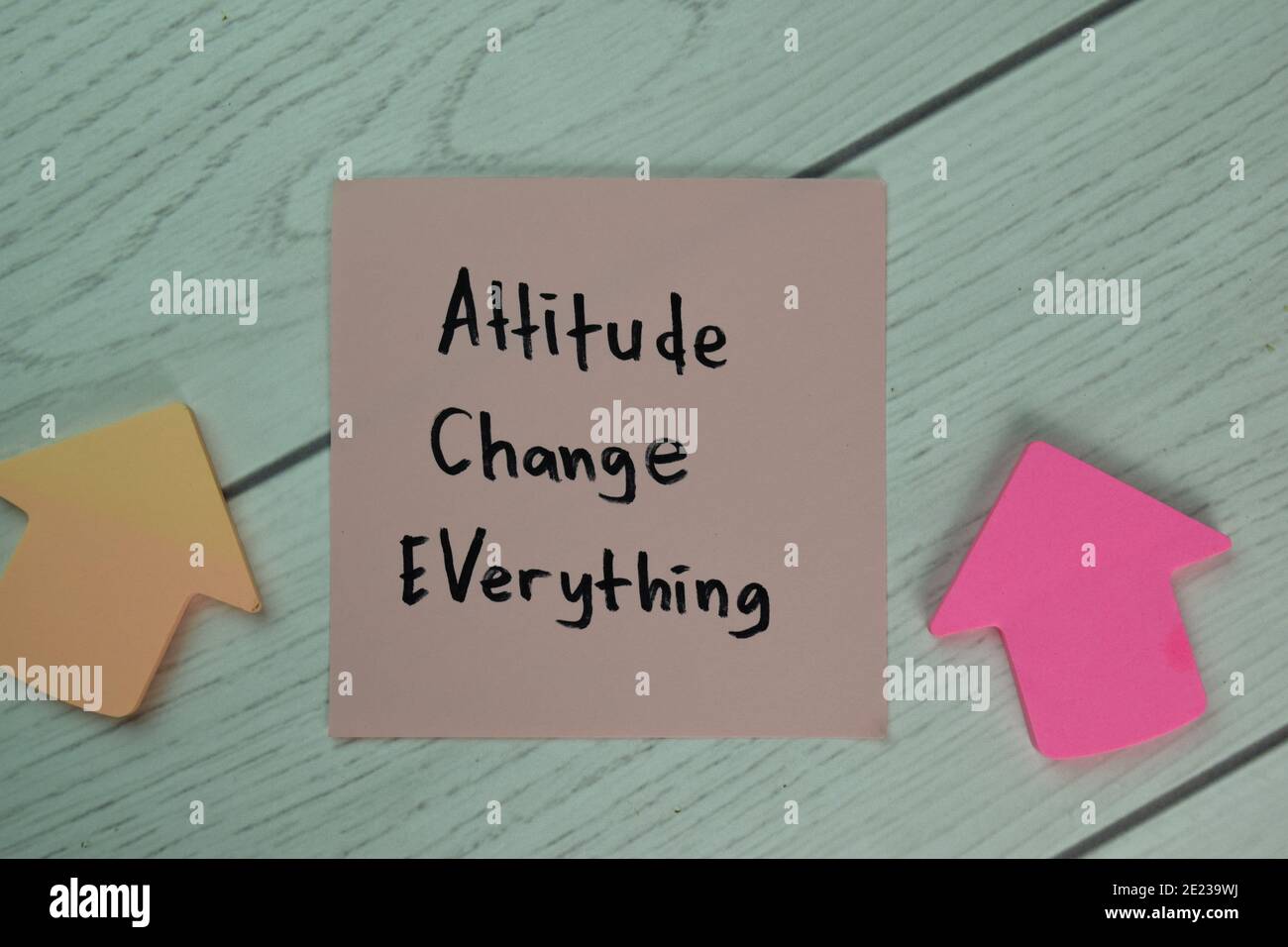 Attitude Change Everything write on sticky notes isolated on Wooden ...