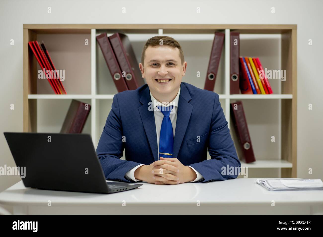 portrait of concentrated lawyer working at workplace with documents in ...