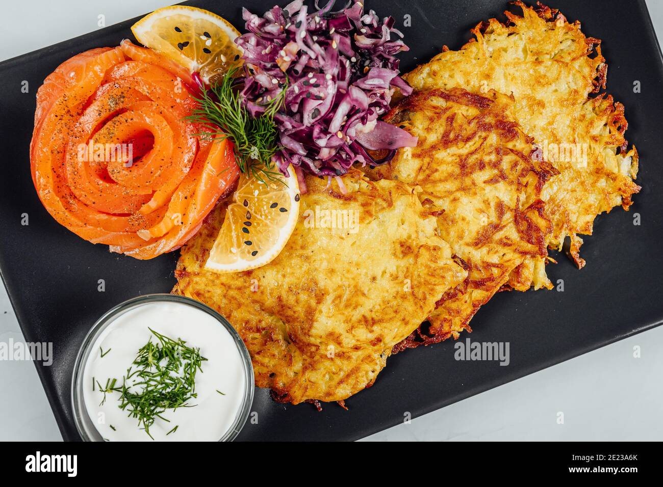 High angle shot of a plate of fried food with some fresh vegetables and ...