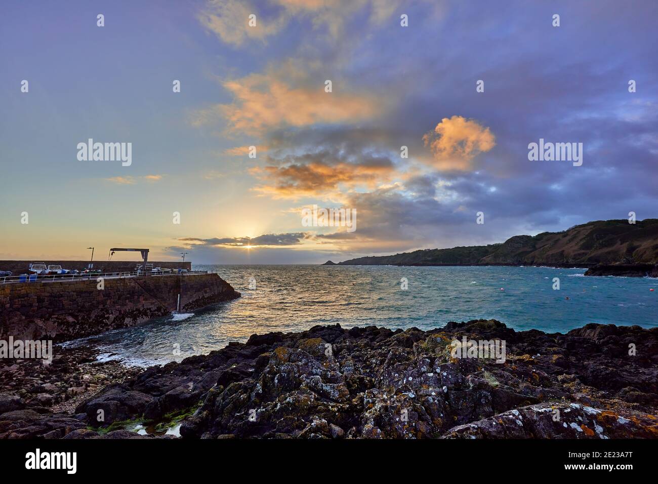 Image of Bouley Bay with pier at sunrise Stock Photo - Alamy