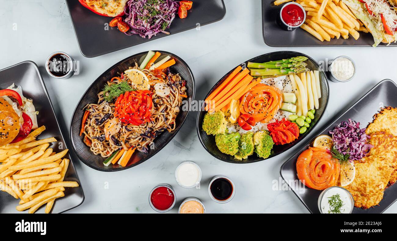 High angle shot of plates of colorful and traditional Japanese food on ...