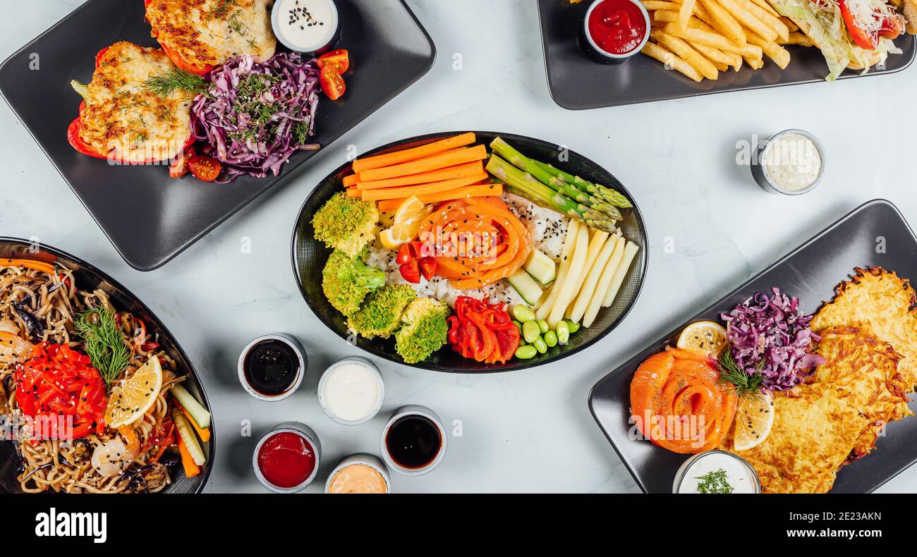 High angle shot of plates of colorful and traditional Japanese food on ...