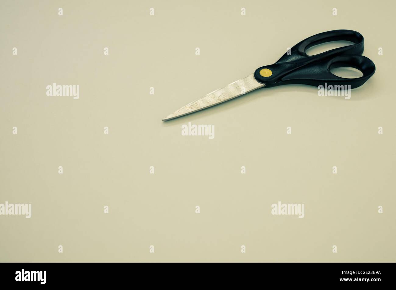 Scissors isolated on a grey background Stock Photo - Alamy
