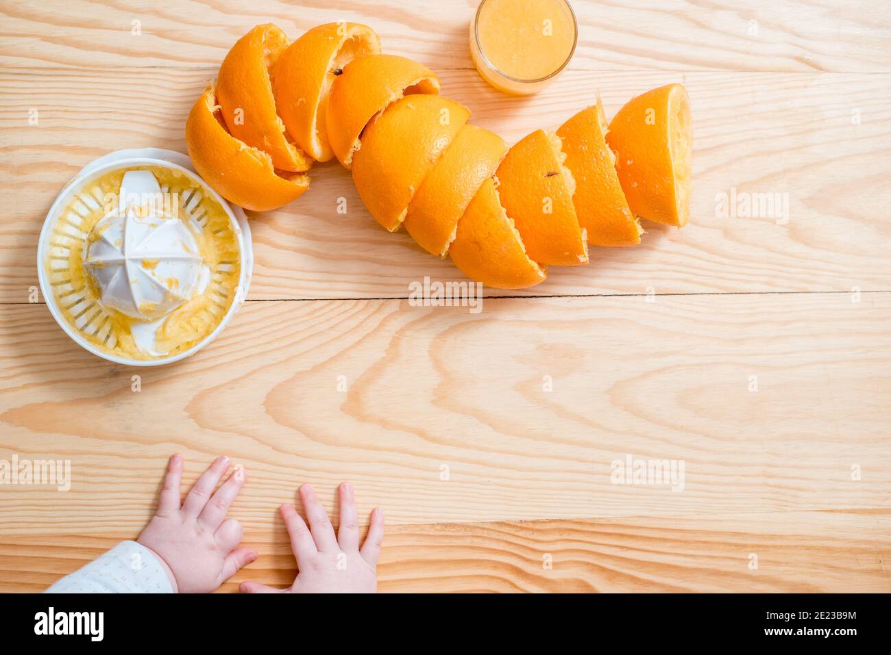 Orange juice freshly squeezed from fresh fruits with a juicer Stock ...