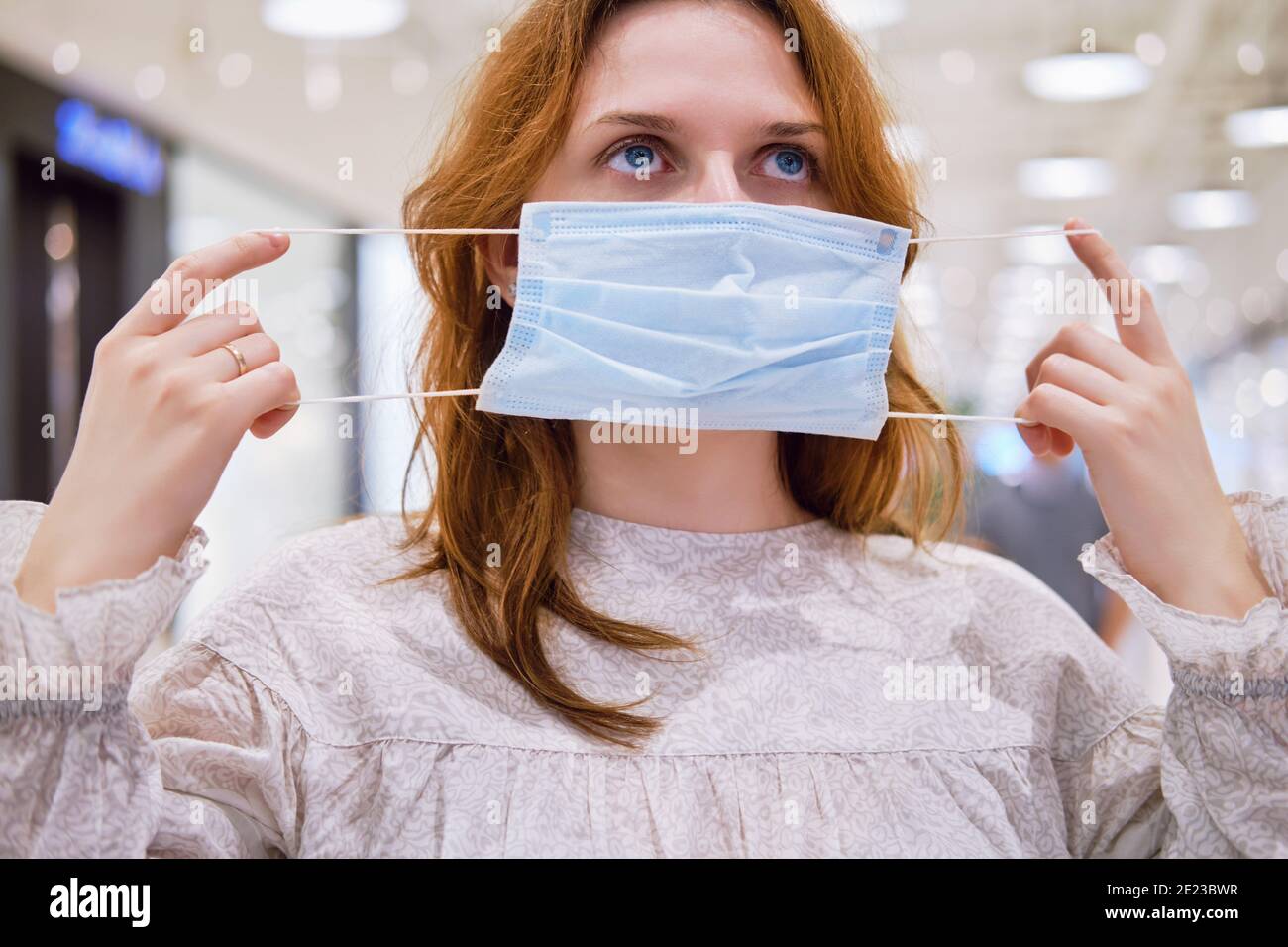 Woman takes off medical mask hi-res stock photography and images - Alamy