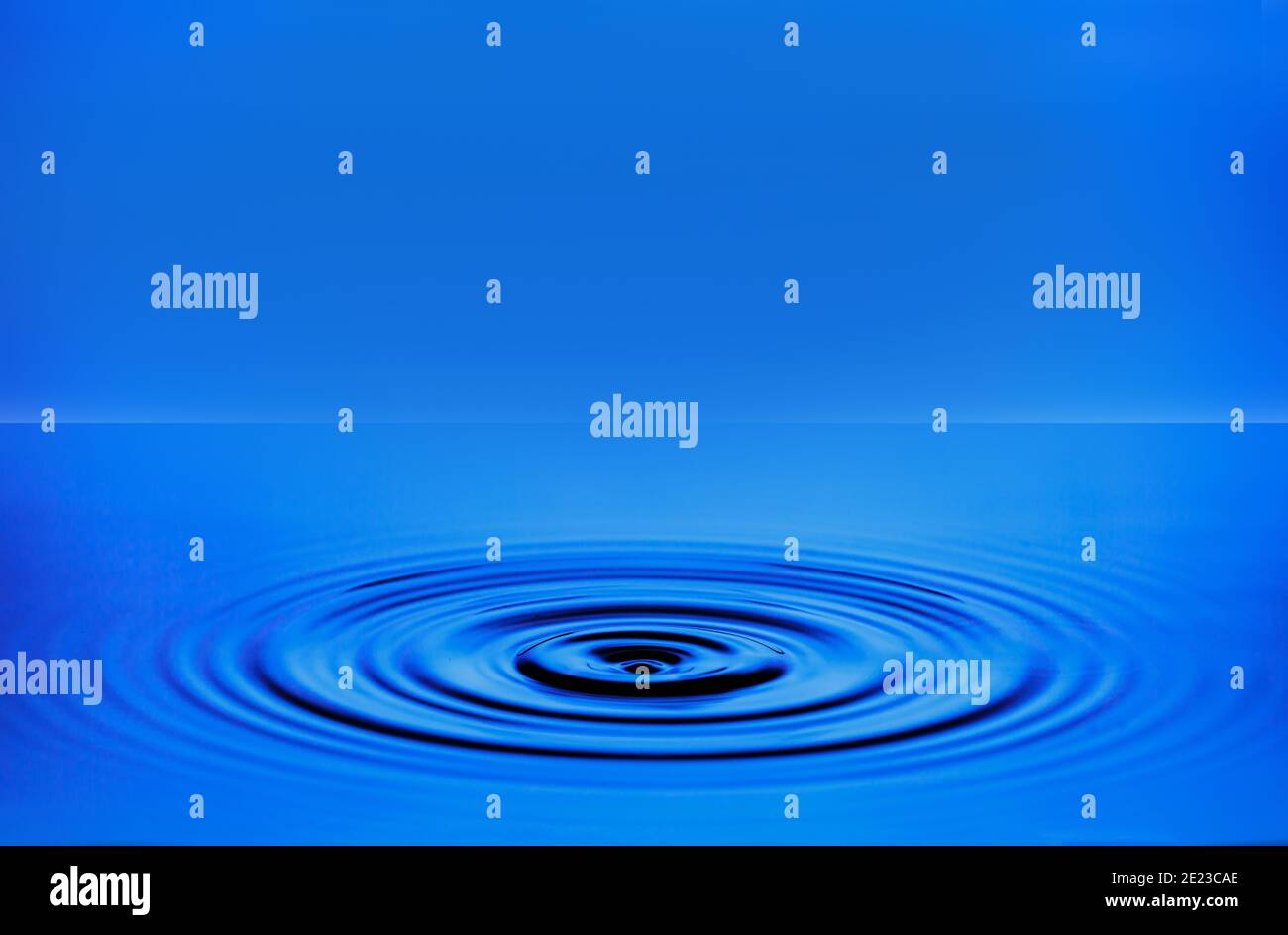 Circular waves on the surface of the blue water Stock Photo - Alamy