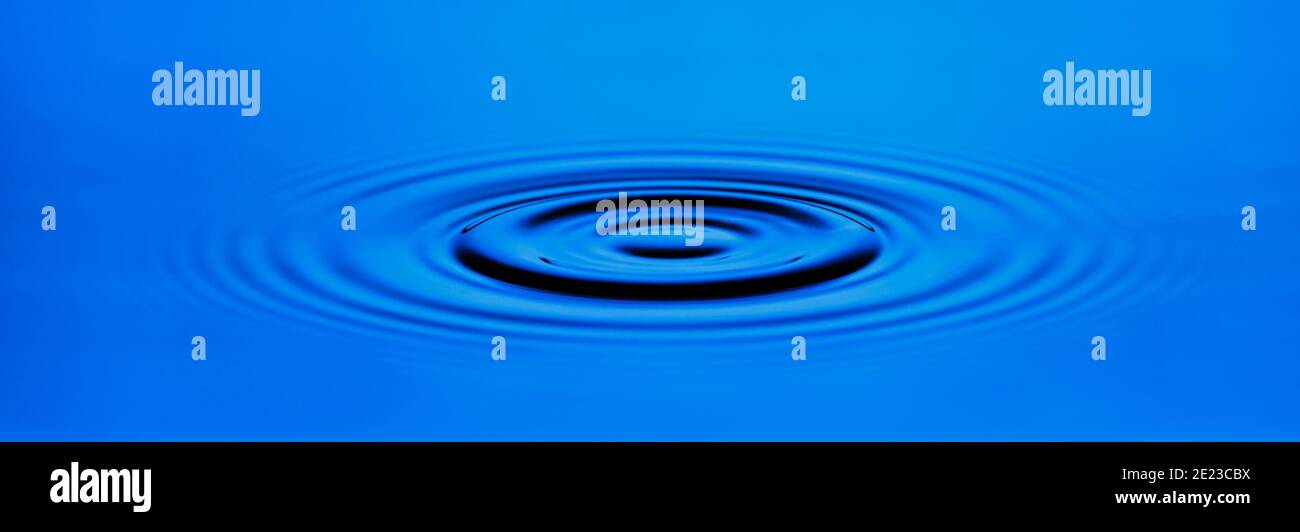The circle ripple of the surface of the blue water Stock Photo - Alamy