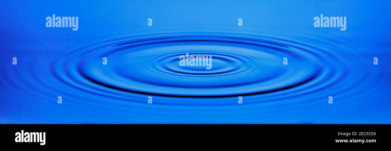 The circle ripple of the surface of the blue water Stock Photo - Alamy