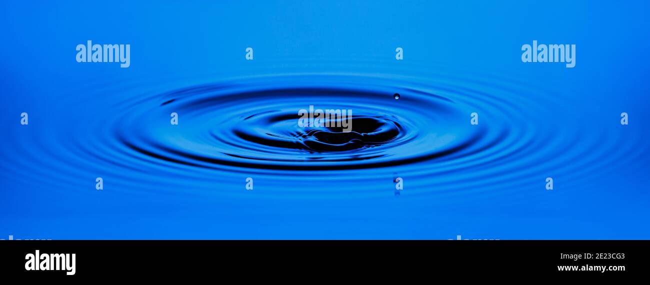 The circle ripple of the surface of the blue water Stock Photo - Alamy