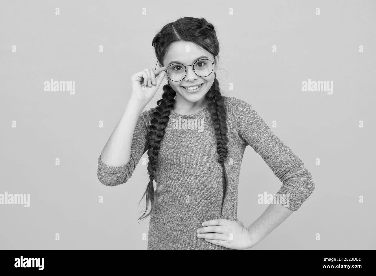 Glasses she likes the look of. Happy girl with intellectual look ...