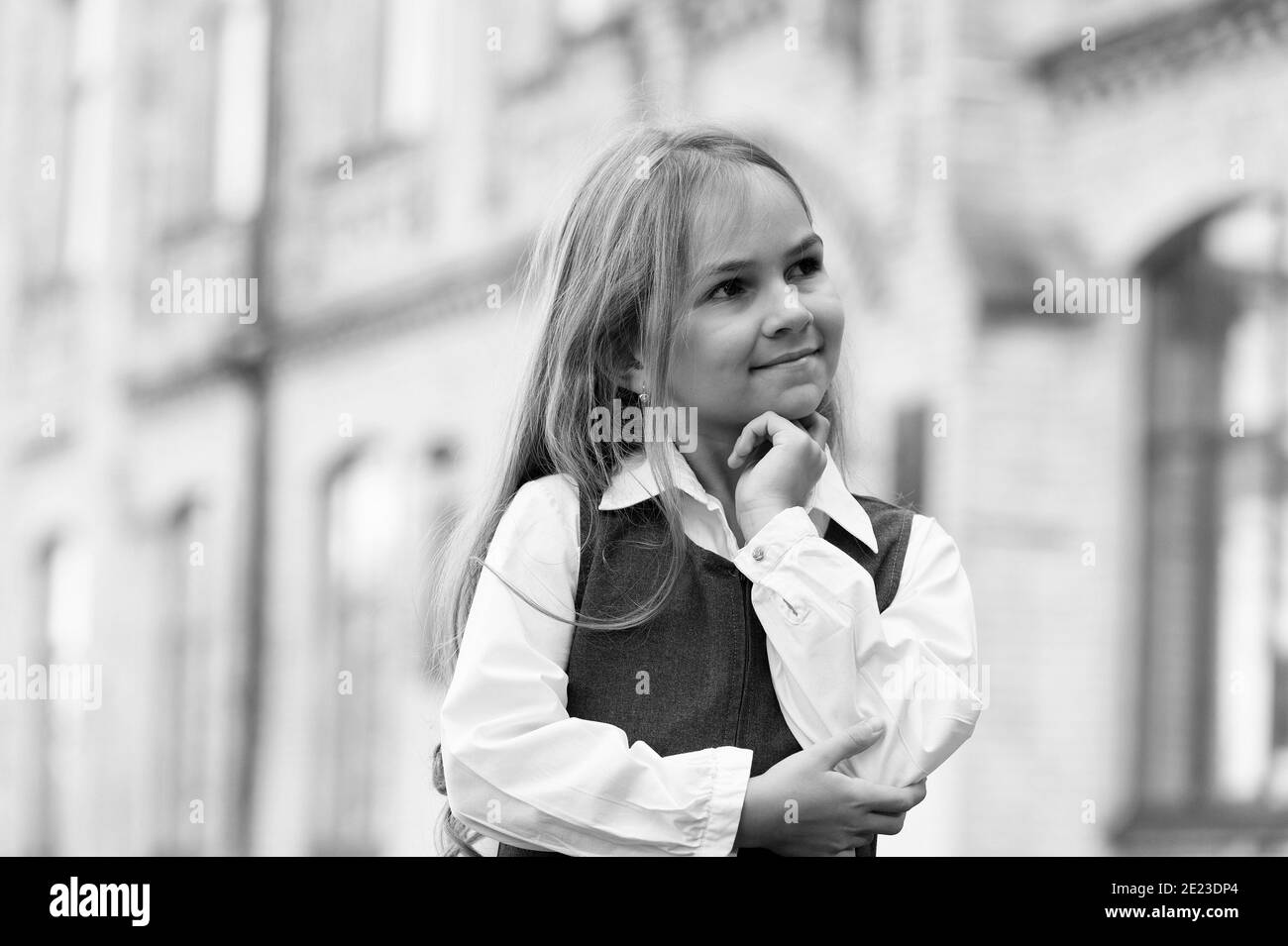 Happy little child lost in thoughts with thoughtful look in school ... Happy little child lost in thoughts with thoughtful look in school ...