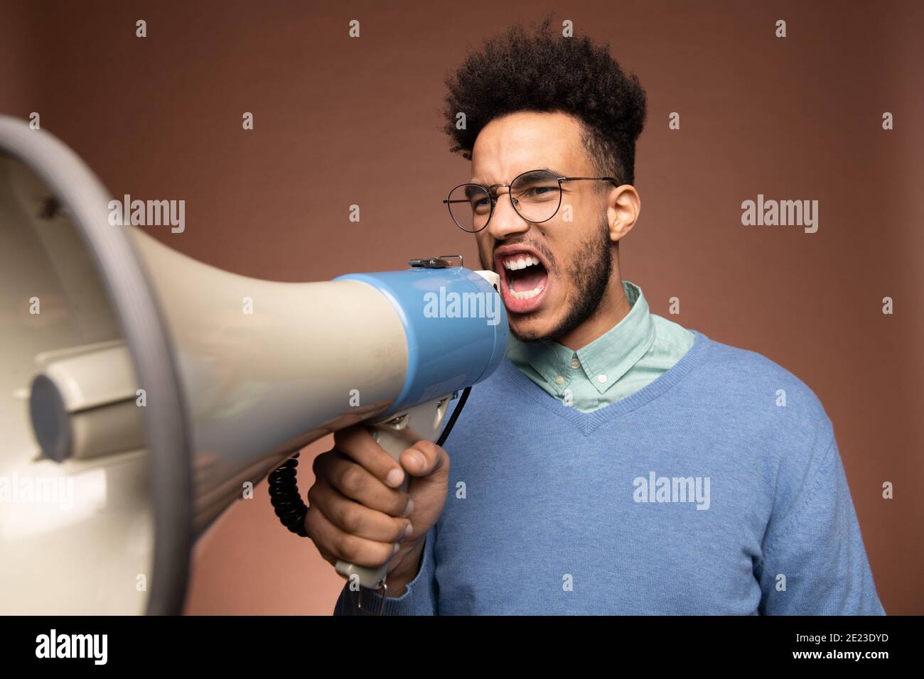 Young african man shouting screaming hi-res stock photography and ...