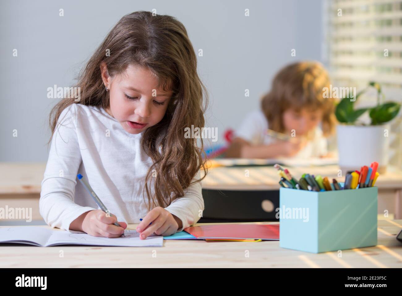 Children, cute girl drawing in classroom at school Stock Photo - Alamy